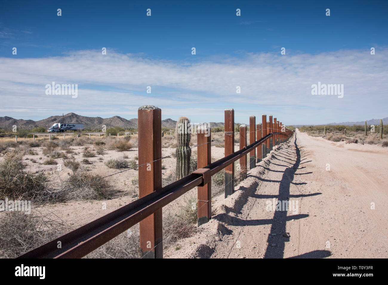 Vehicular restriction wall or fence along the international border ...