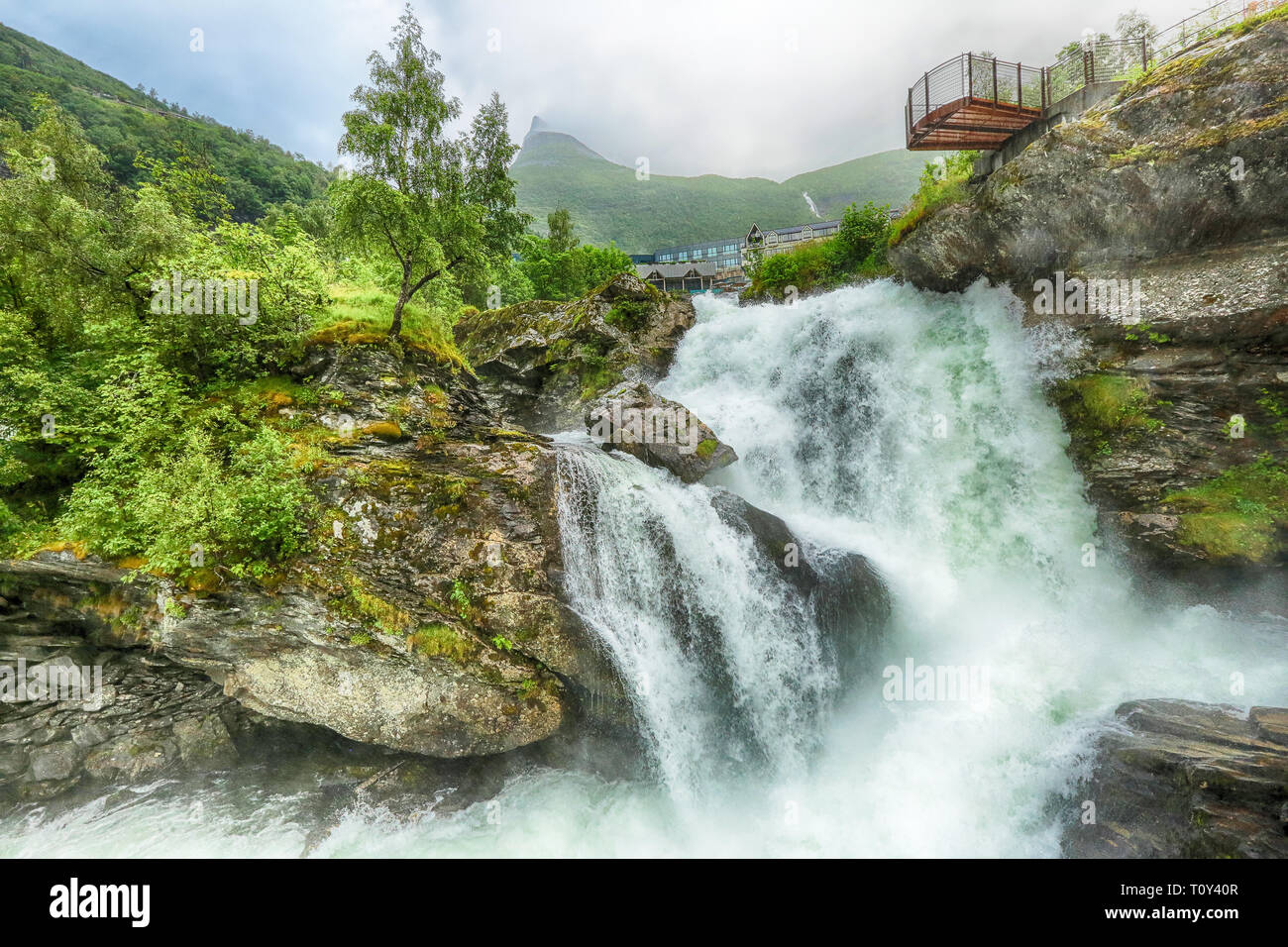 Waterfall in the norwegian town geiranger located on the UNESCO ...