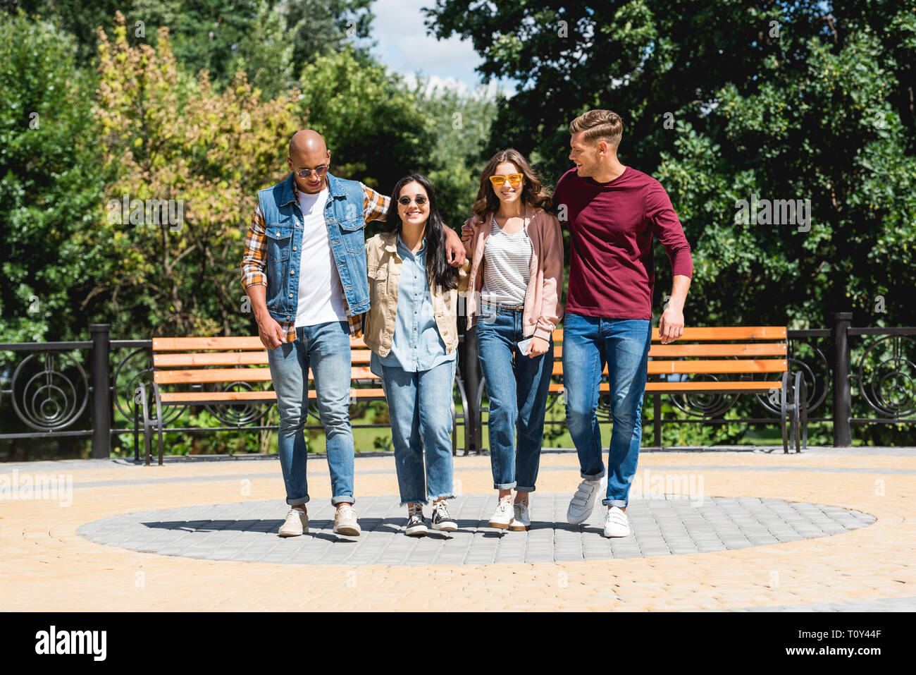 Male friends walking park spring hi-res stock photography and images ...