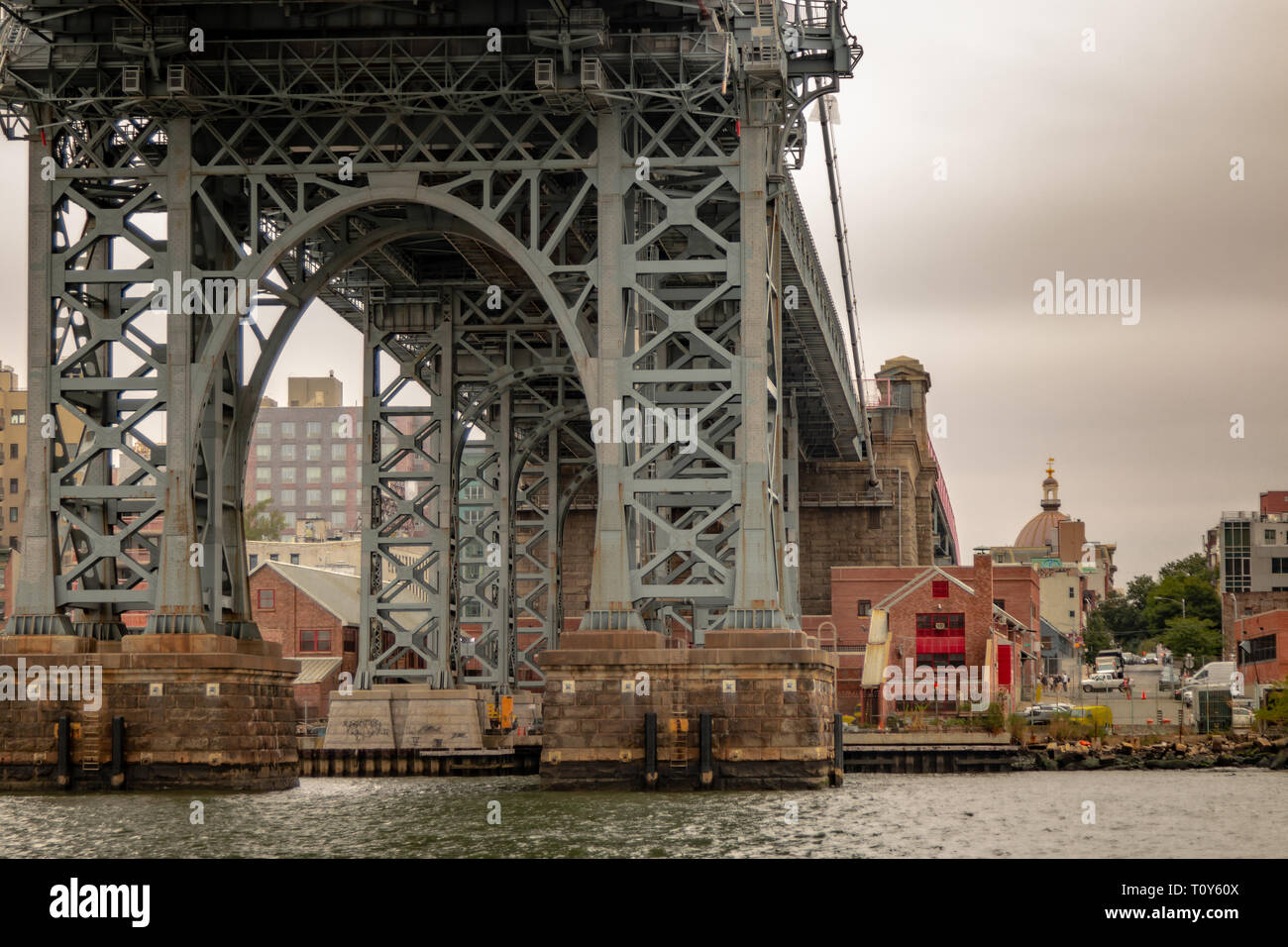 The Williamsburg Bridge, a suspension bridge in New York City, crosses the East River connecting ...