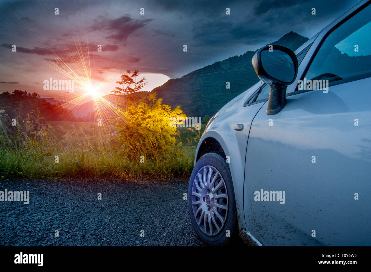 car on the road at sunset Stock Photo - Alamy
