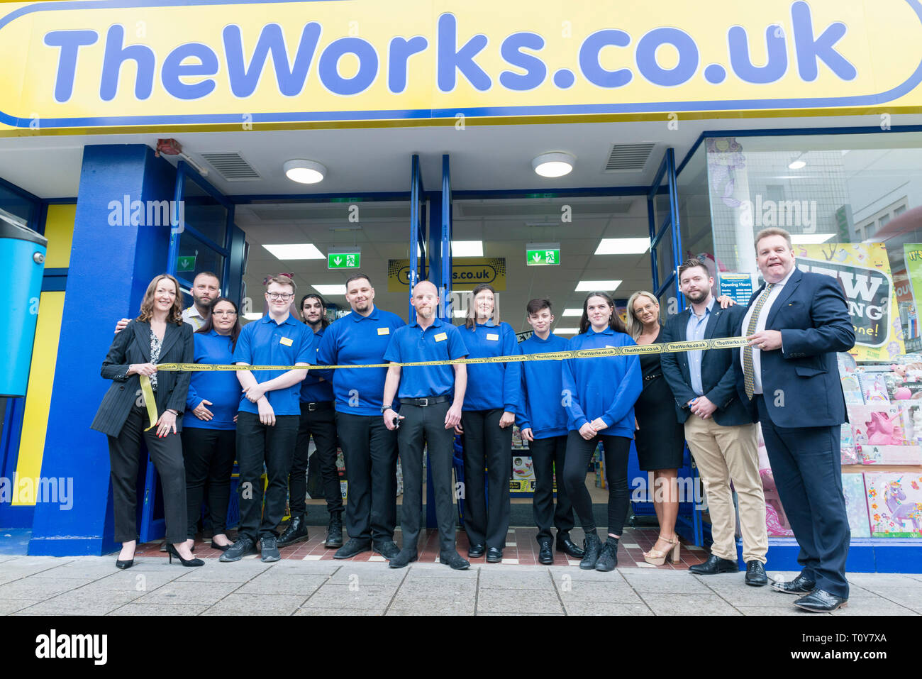 the grand opening of a shop from The Works with the ribbon cutting ...