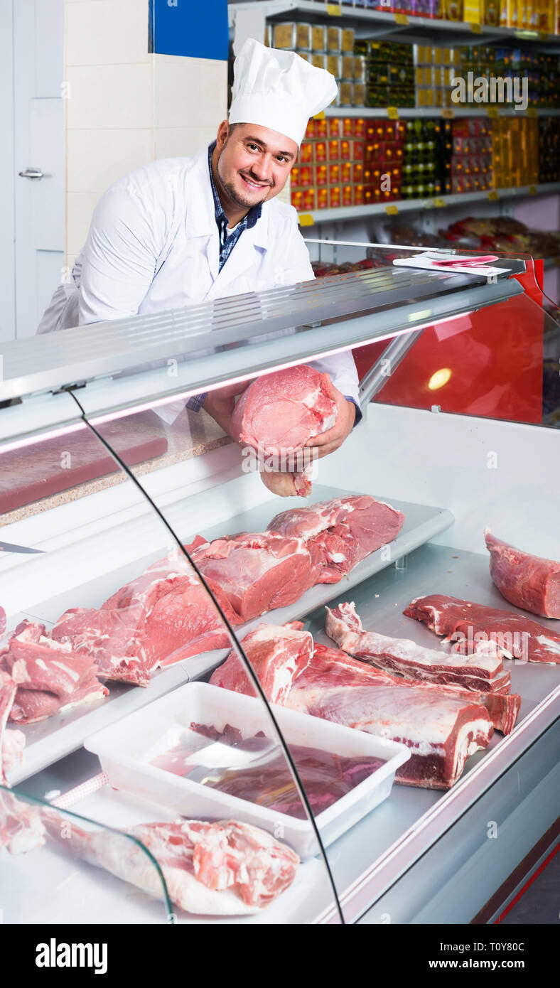 Portrait of smiling male butcher in kosher section at supermarket Stock ...