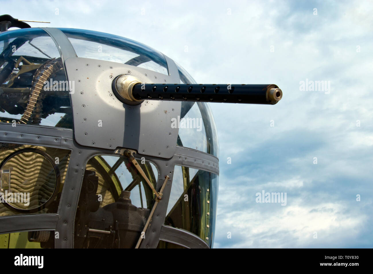 A machine gun in the nose of a World War Two era bomber aircraft ...