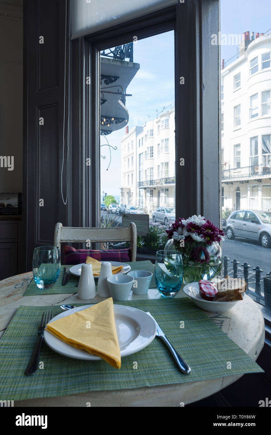 a dining table set out for breakfast in a hotel Stock Photo - Alamy