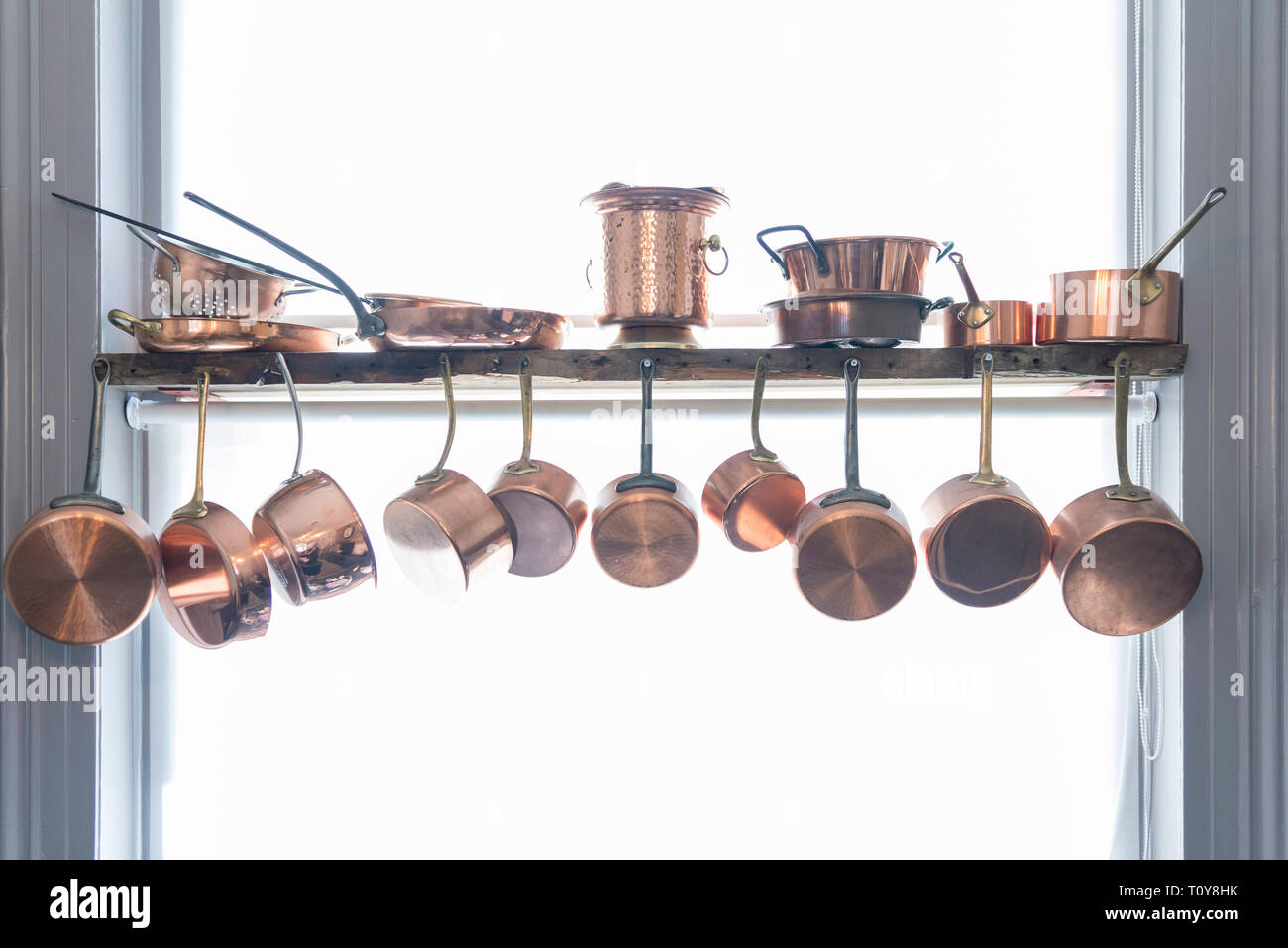 Hanging pans in kitchen hi-res stock photography and images - Alamy