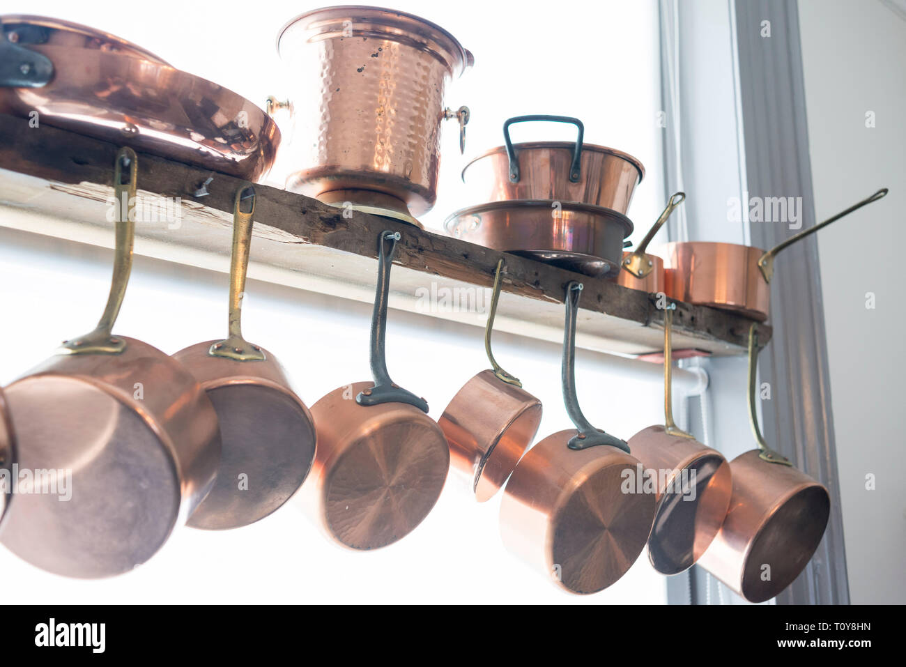 Hanging pans in kitchen hi-res stock photography and images - Alamy