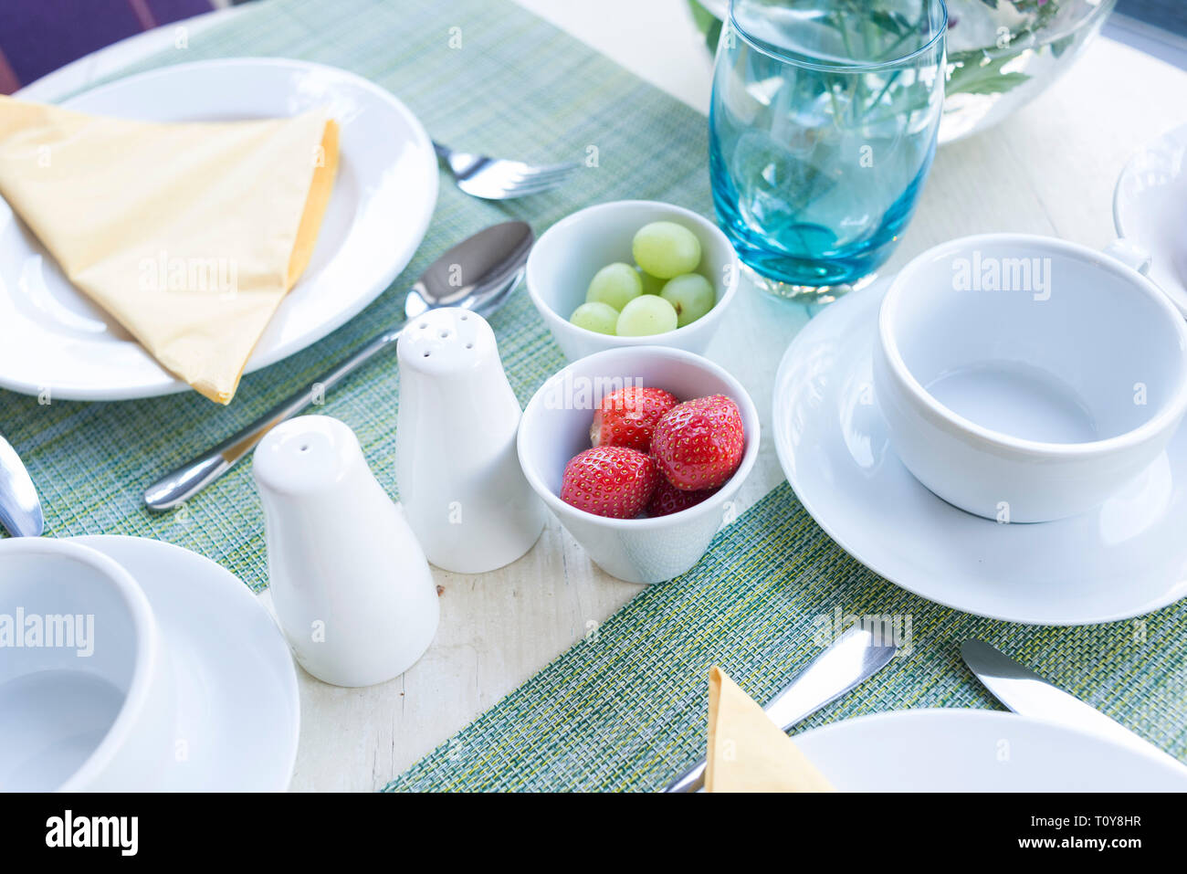 breakfast food and drink is laid out in a hotel ready for the guests ...