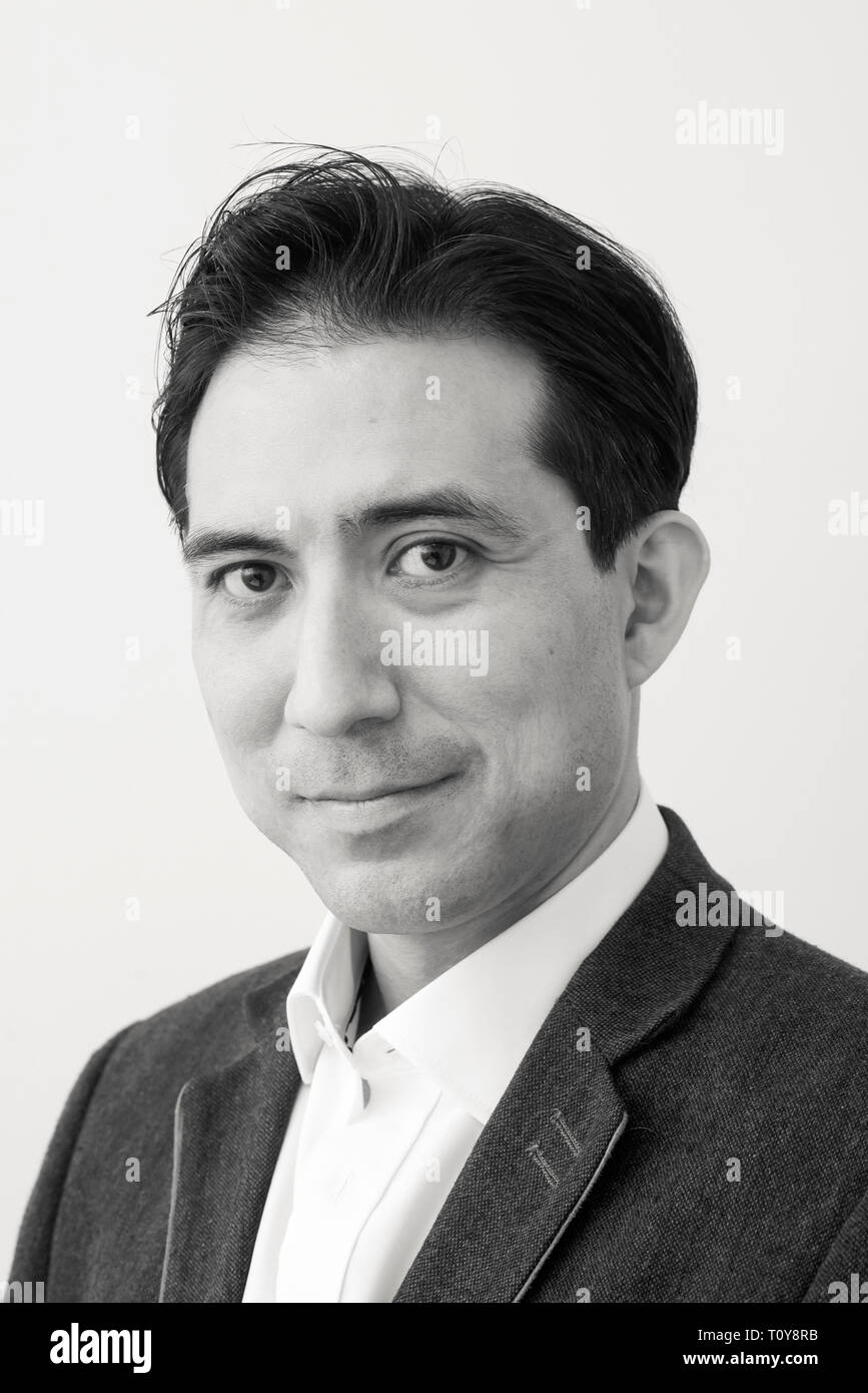 a real business man stands in front of a white background Stock Photo ...