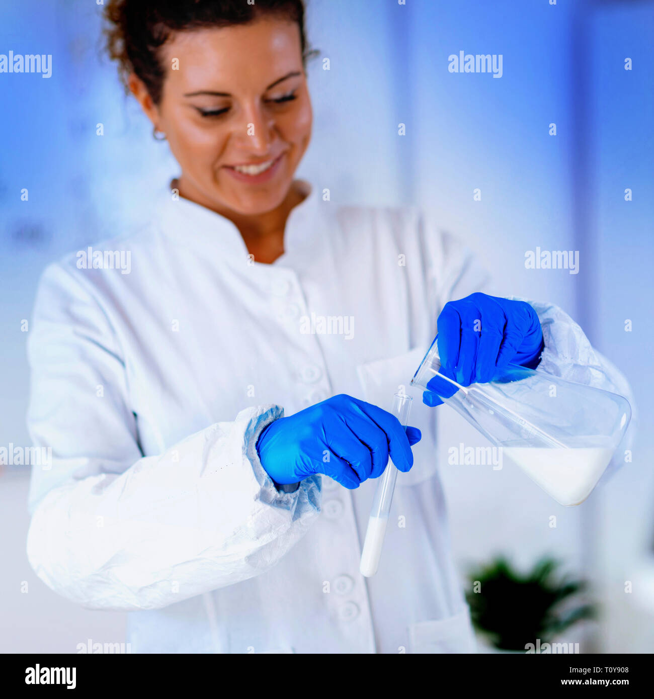 Quality control expert inspecting milk in the laboratory Stock Photo ...