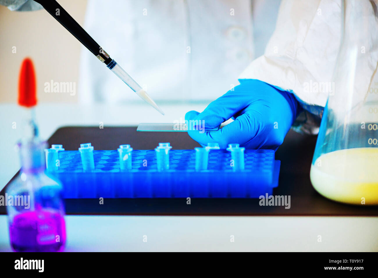 Quality control expert inspecting milk in the laboratory Stock Photo ...