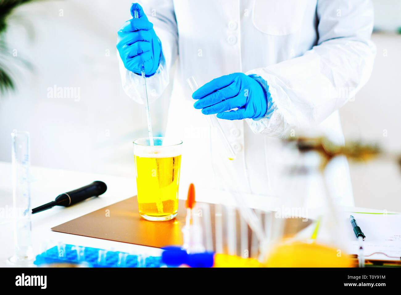 Quality control expert inspecting beer in the laboratory Stock Photo ...