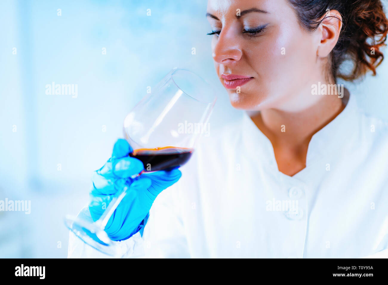 Quality control expert inspecting red wine in the laboratory Stock ...