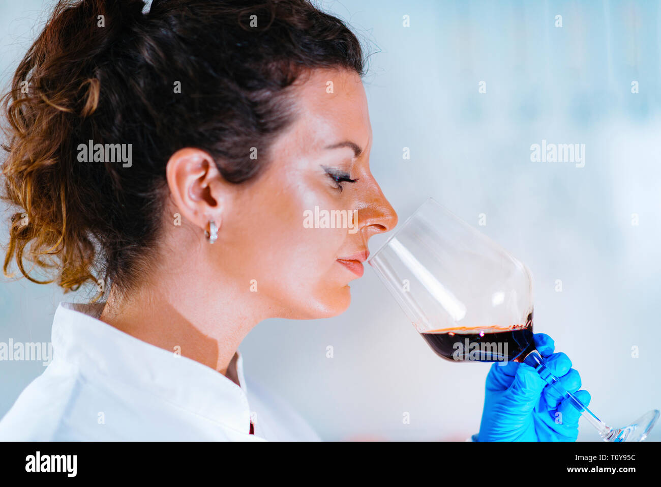 Quality control expert inspecting red wine in the laboratory Stock ...