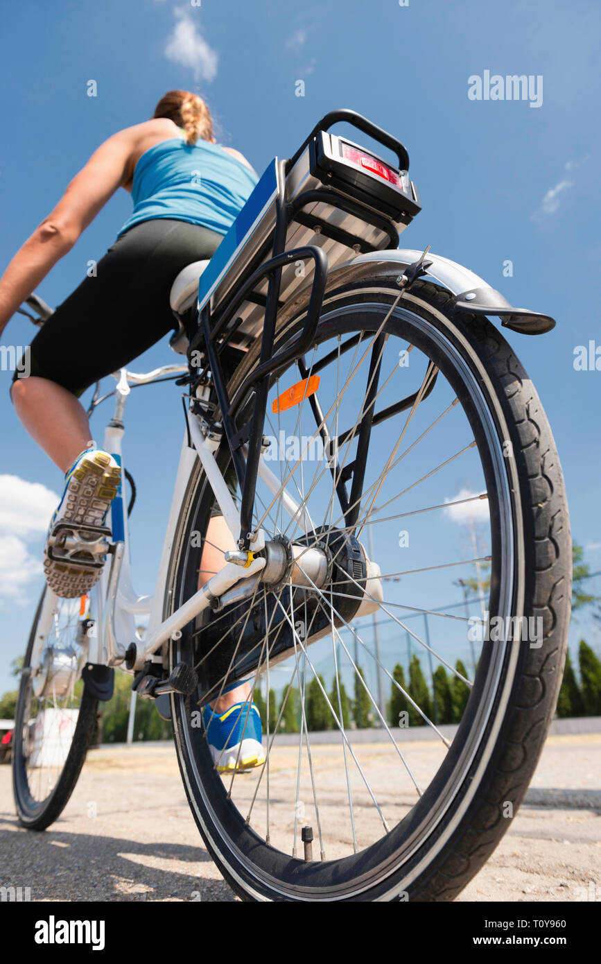 Woman with e bike hi-res stock photography and images - Alamy