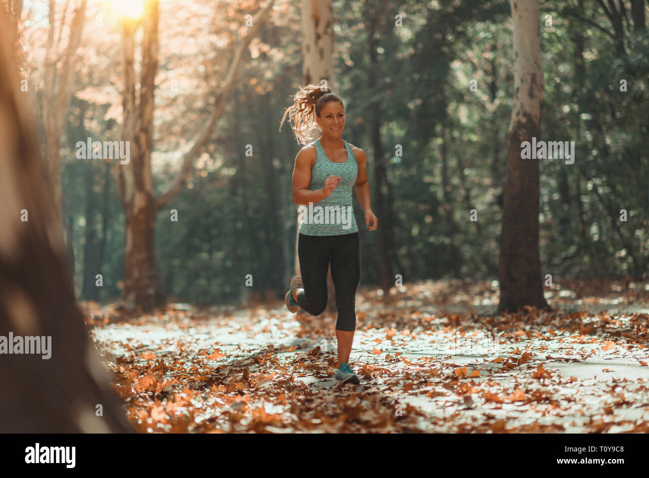 Women jogging autumn hi-res stock photography and images - Alamy