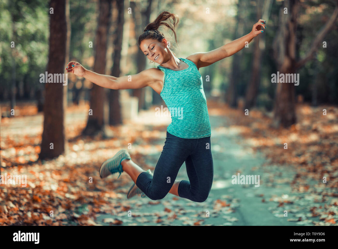 Woman star jump hi-res stock photography and images - Alamy