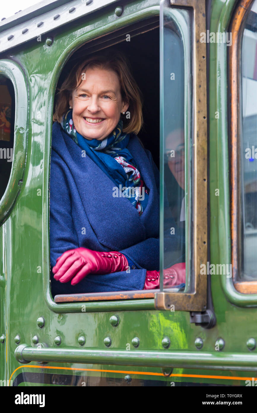 Penny is looking out of the locomotive cab window hi-res stock ...