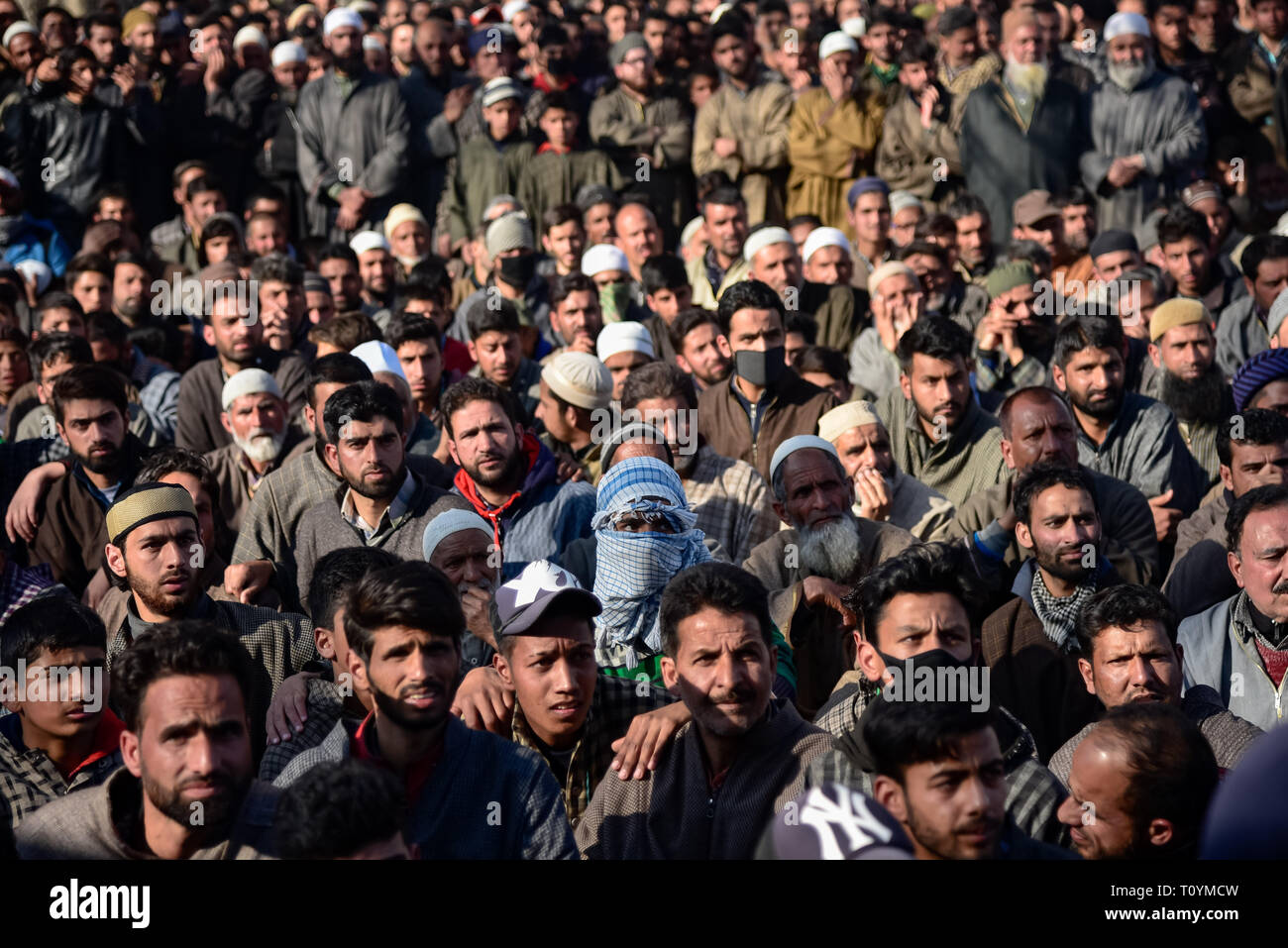 Kashmiri villagers are seen watching funeral procession of Slain Atif ...