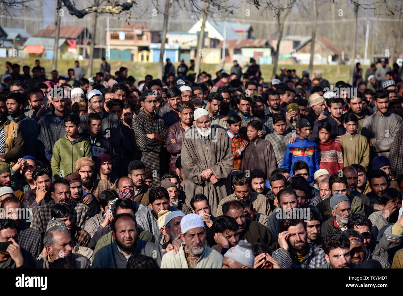 Kashmiri villagers are seen watching funeral procession of Slain Atif ...