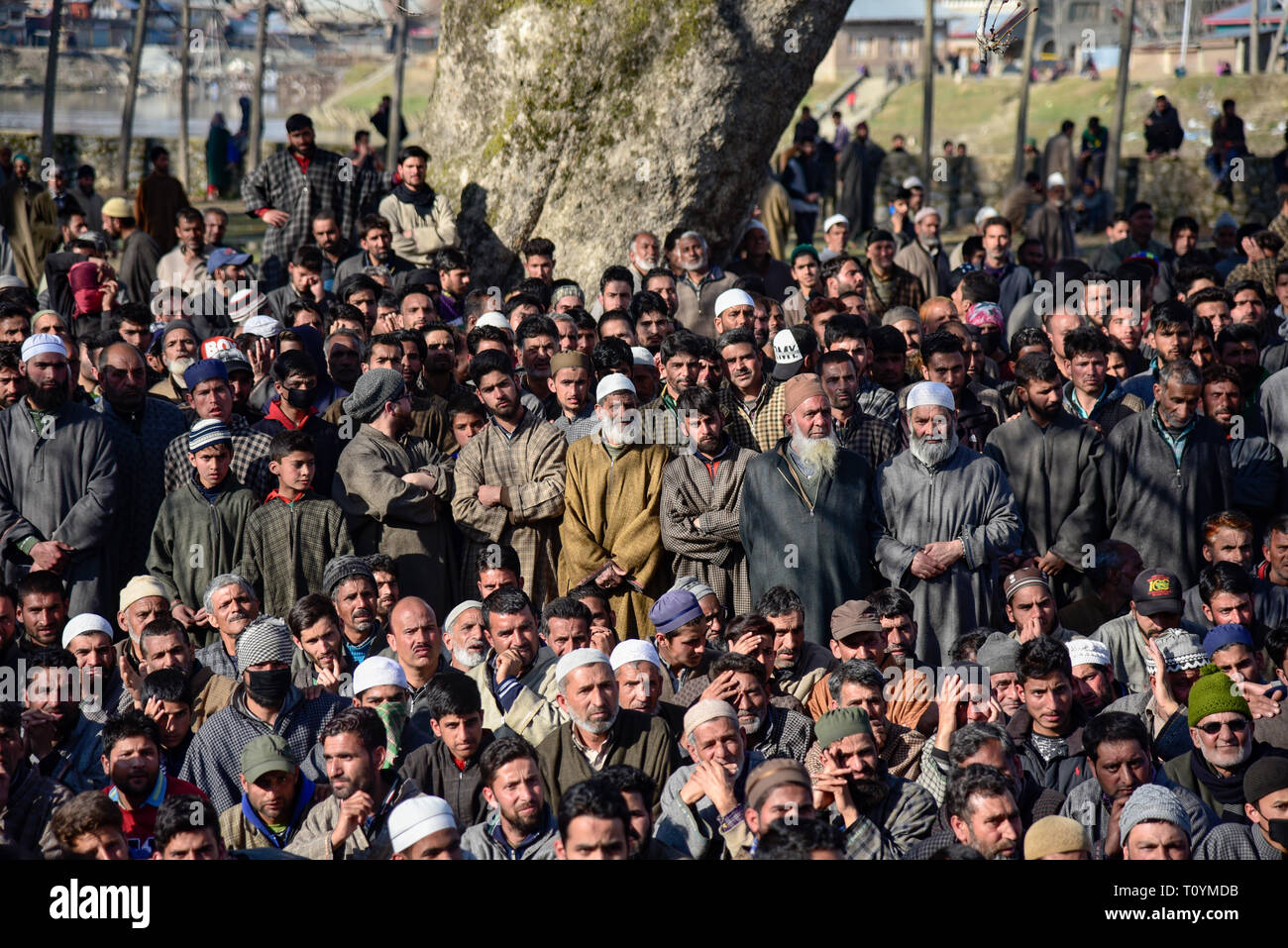 Kashmiri villagers are seen watching funeral procession of Slain Atif ...