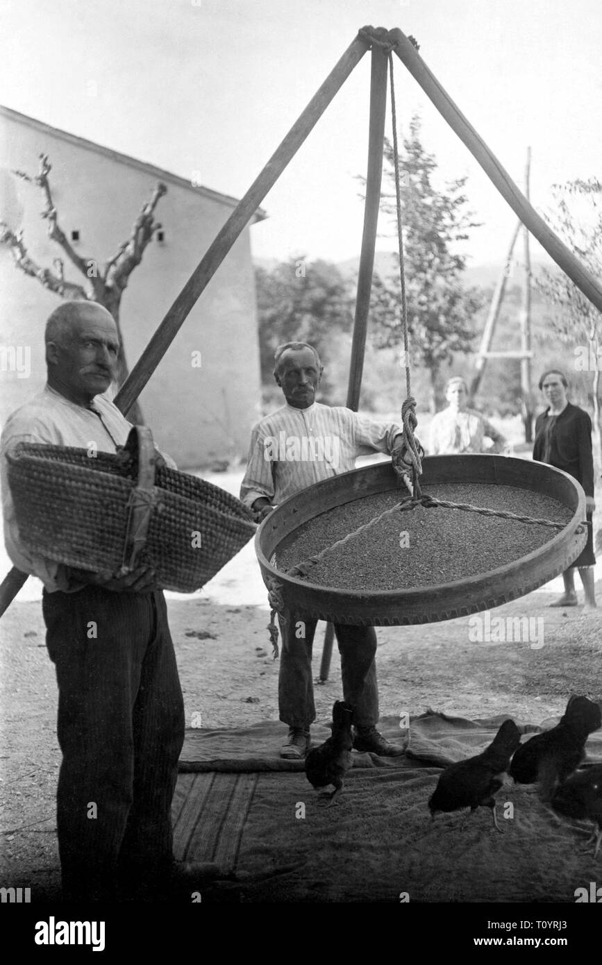 Winnowing corn Black and White Stock Photos & Images - Alamy