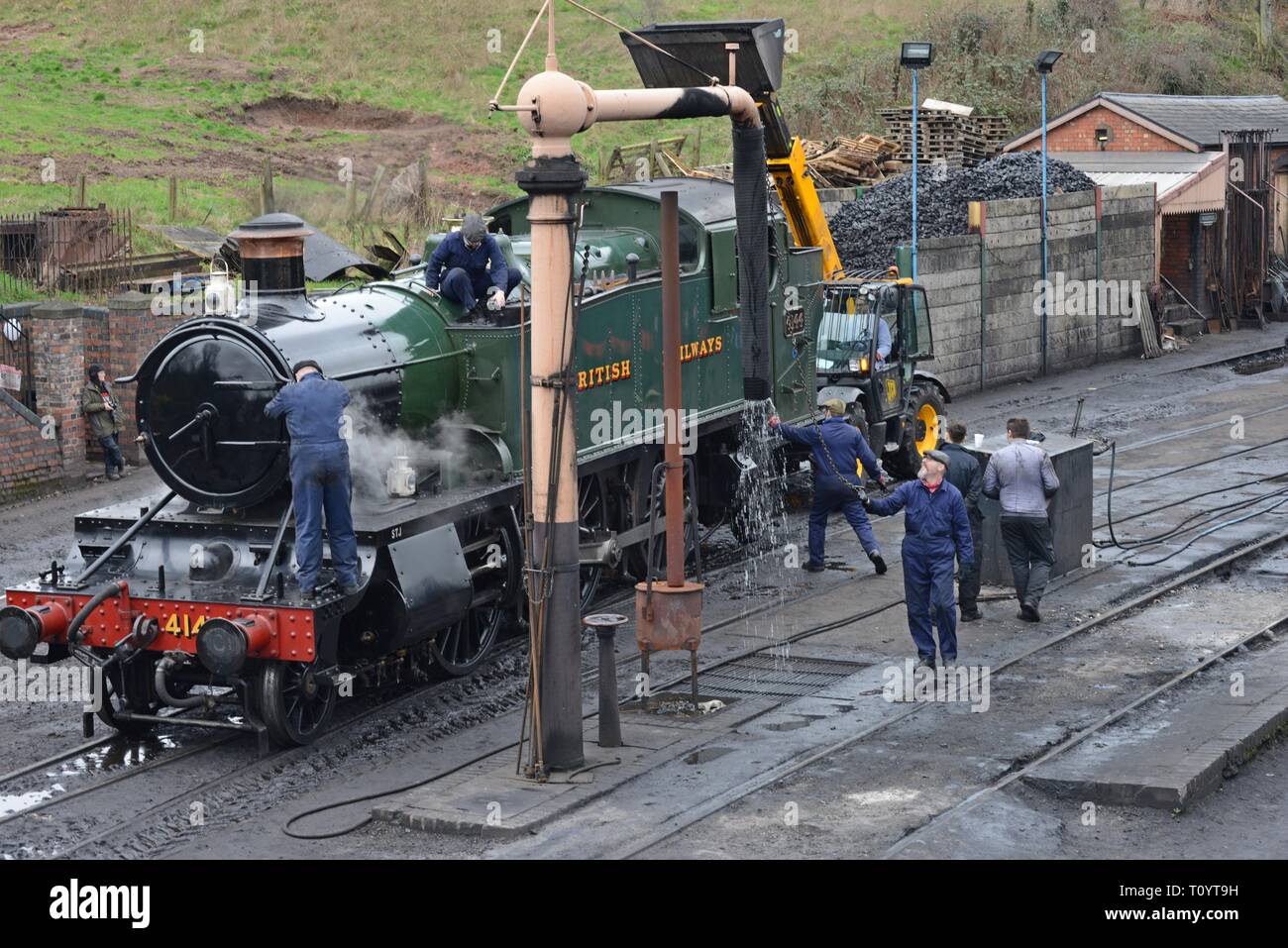 Great Western Railway steam locomotive 4144 is filled with coal & water ...