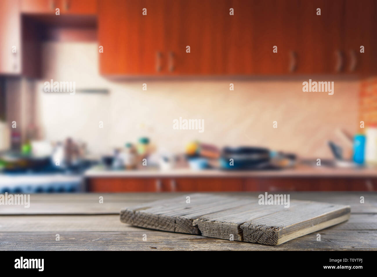 Kitchen background with vintage kitchen board on the table Stock Photo ...