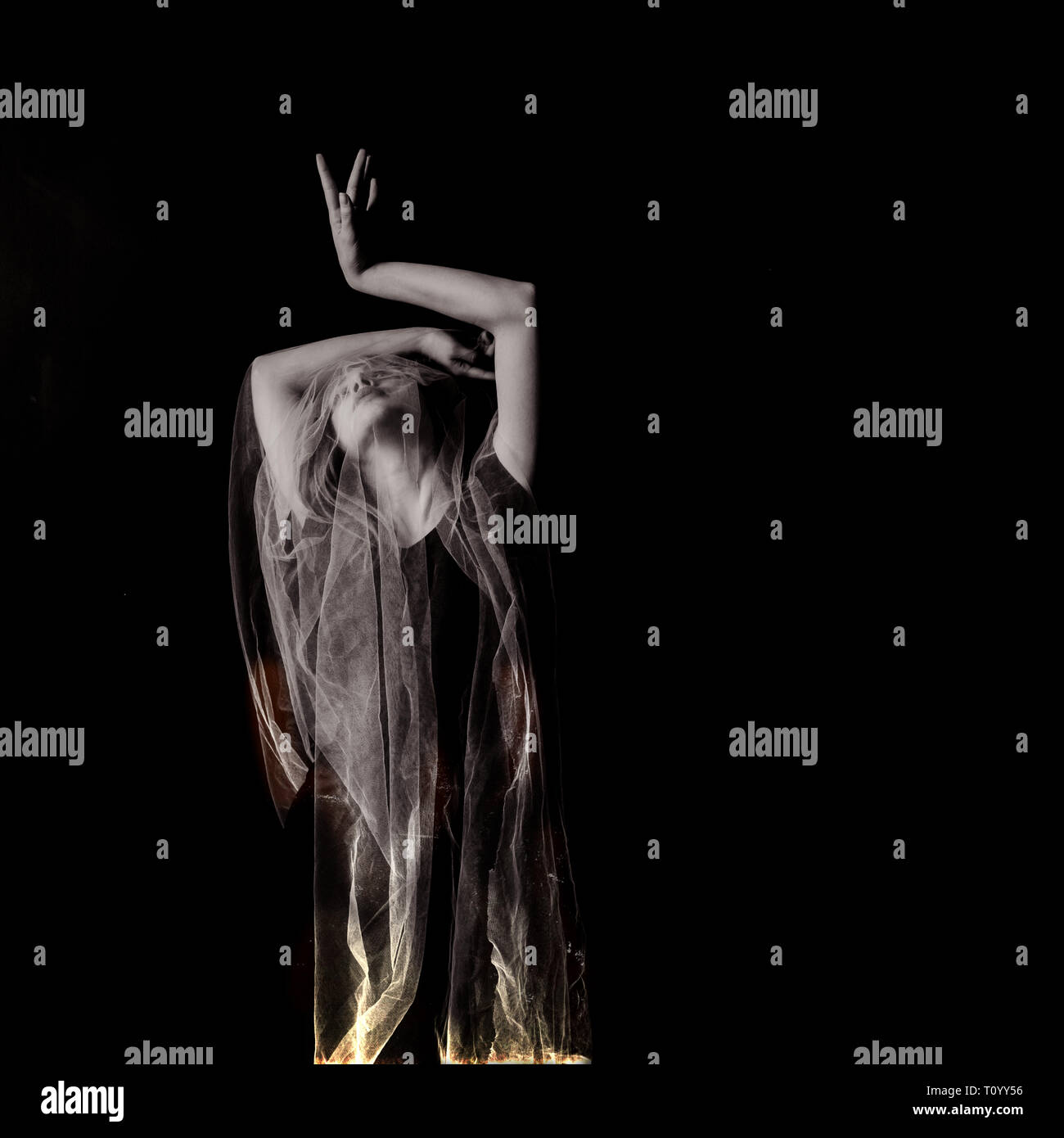 Young woman dancing in dark Stock Photo - Alamy