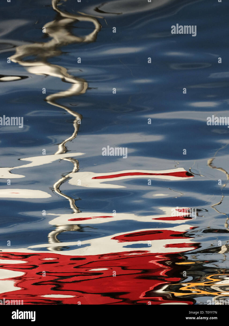 Water reflection of a fishing boat Stock Photo - Alamy