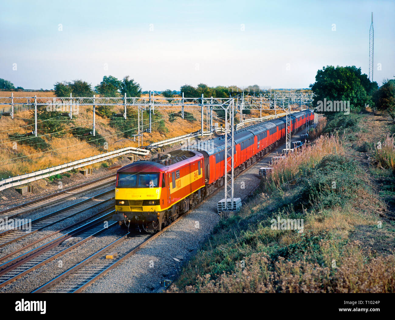 A class 90 electric locomotive number 90031 working a Royal Mail postal ...