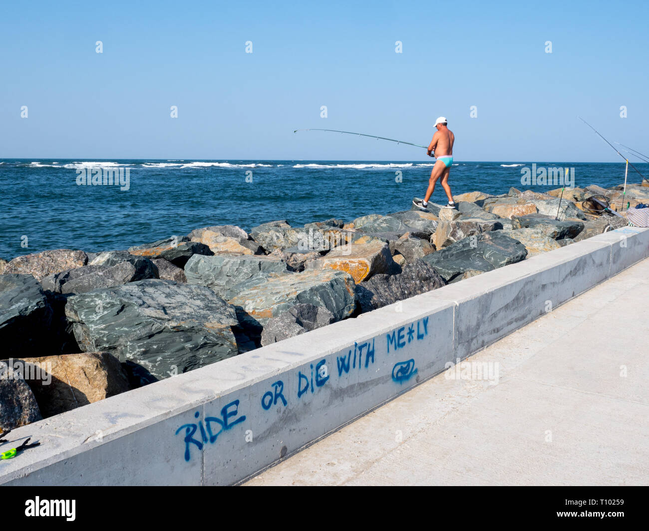 Fisherman in swimming trunks hi-res stock photography and images - Alamy