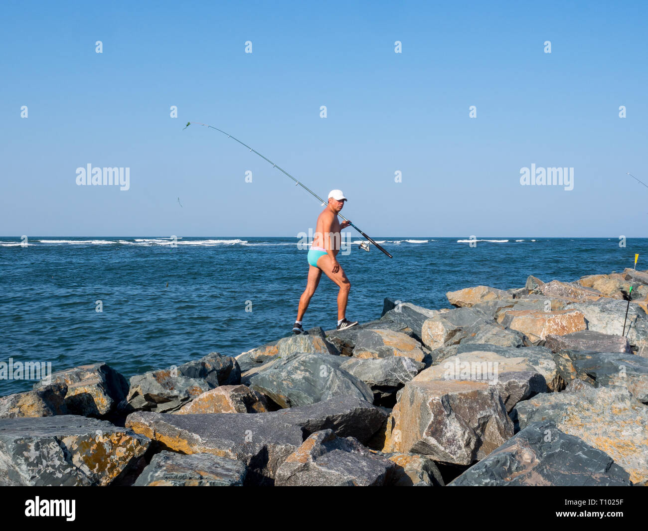 Black swimming trunks hi-res stock photography and images - Alamy