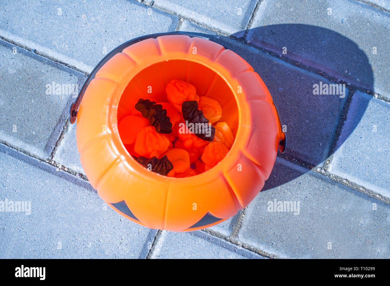 Pumpkin-shaped sweets bag full of gummy jelly bat candies. Urban ...