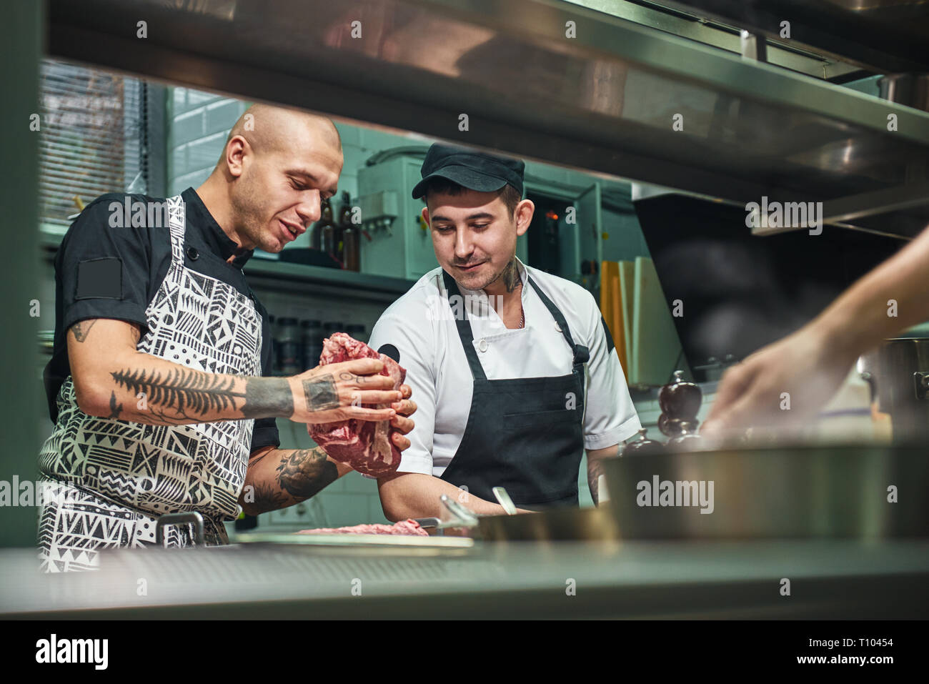 How to choose the right meat Professional chef in apron and with ...