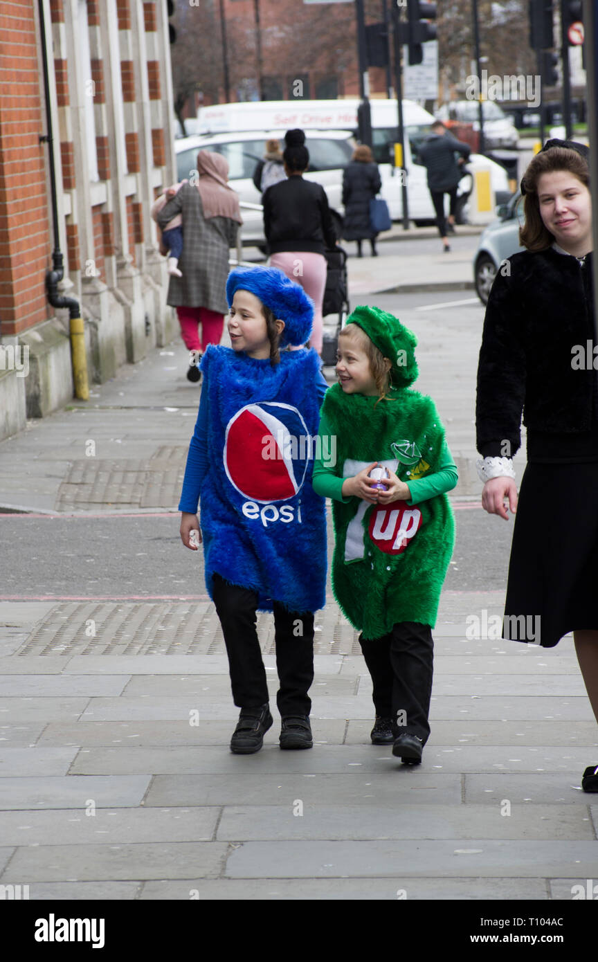 Two Hasidic Jewish kids in fancy dress as bottles of pepsi and 7 up for ...