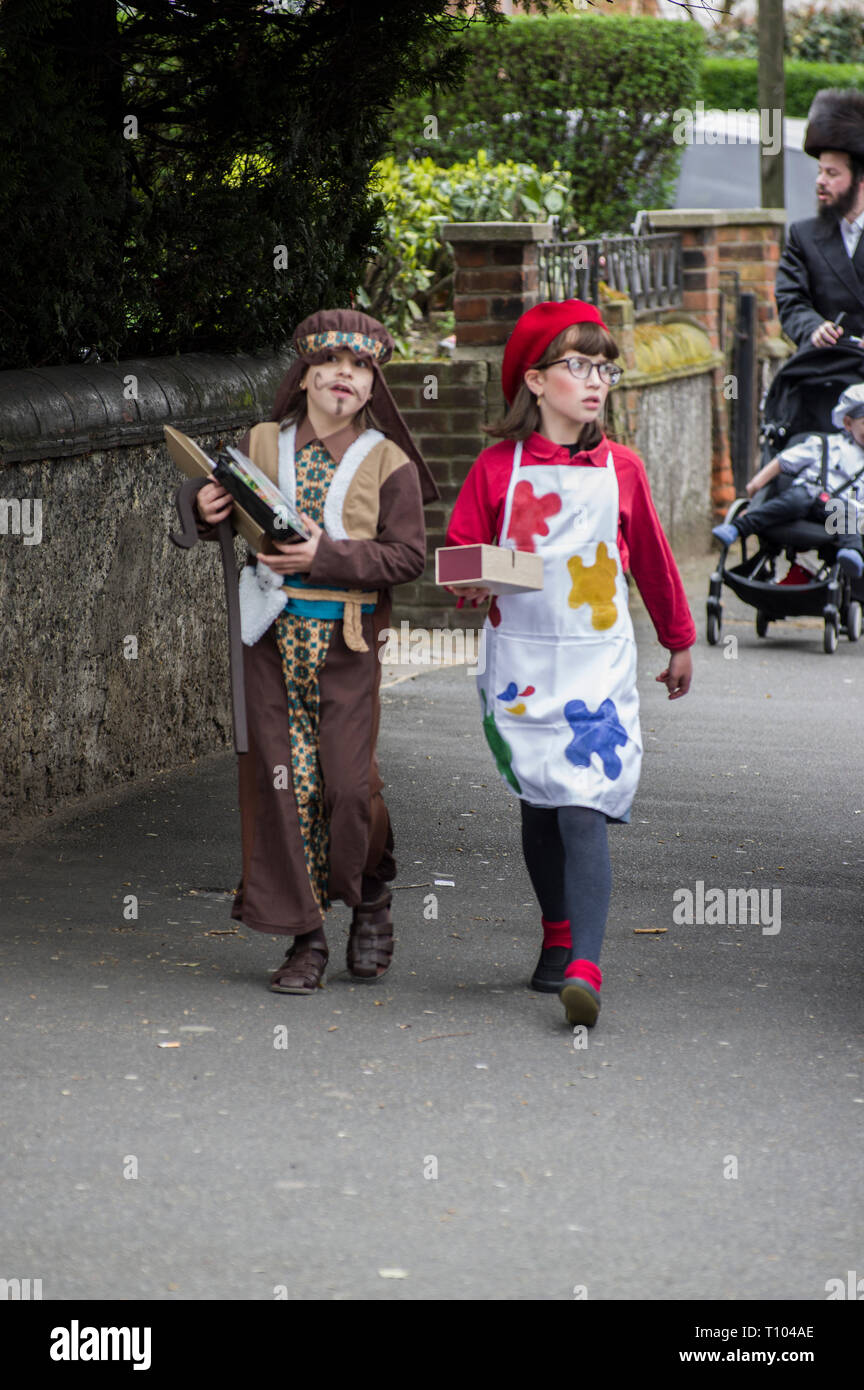 Two Jewish children in fancy dress for the Purim holiday, one in a ...