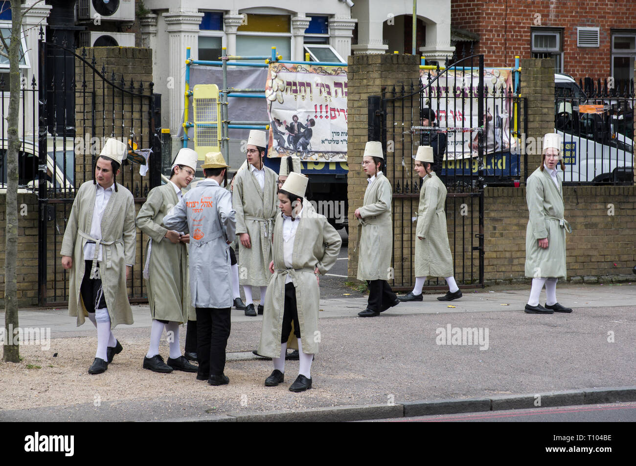 Hasidic boys young men in fancy dress in Stamford Hill dance and sing ...