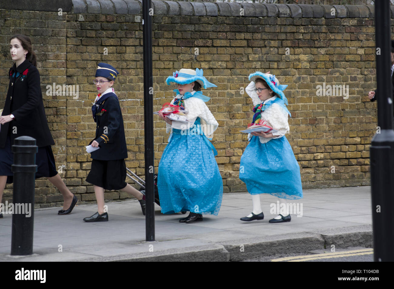 Two Jewish girls in fancy dress for the Purim holiday, one costumed as ...