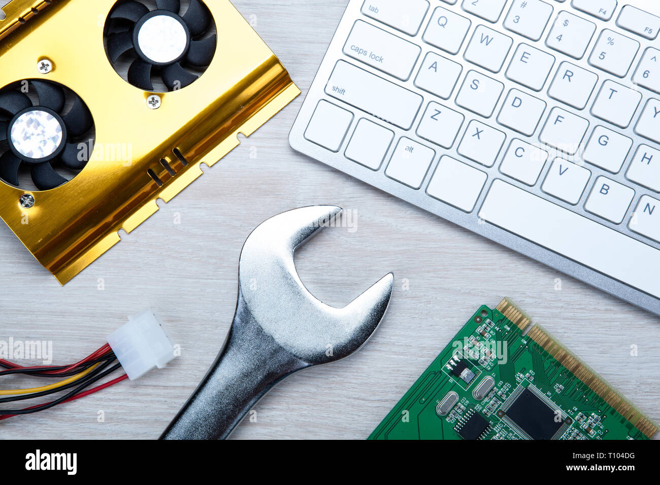big wrench and a computer keyboard and computer parts top view Stock ...