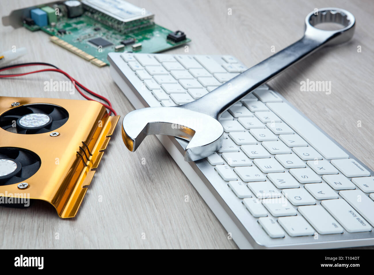 big wrench and a computer keyboard and computer parts close up Stock ...
