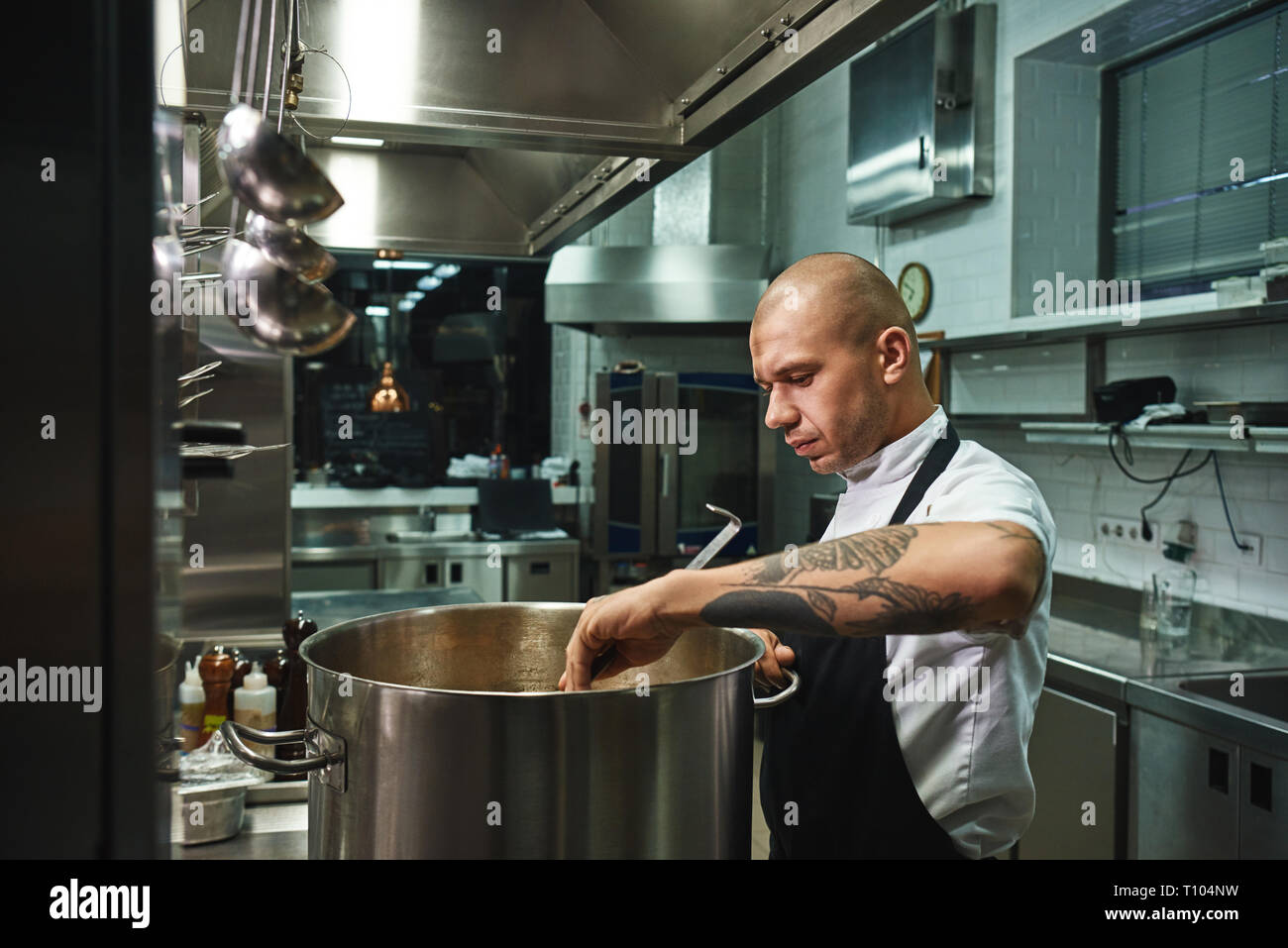 Step by step. Cooking famous soup by professional male chef in a ...