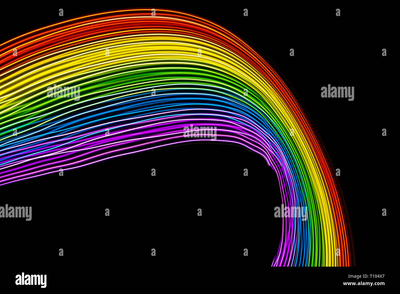 Multicolor lights on black background. Rainbow of vibrant colors curves ...