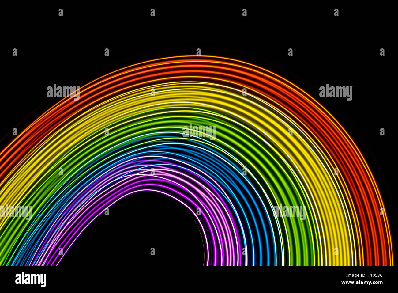 Multicolor lights on black background. Rainbow of vibrant colors curves ...