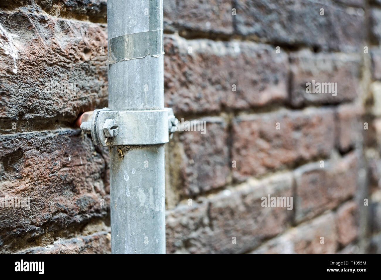 EMT PIPE Electrical Metallic Tubing and junction box on the grey bricks ...