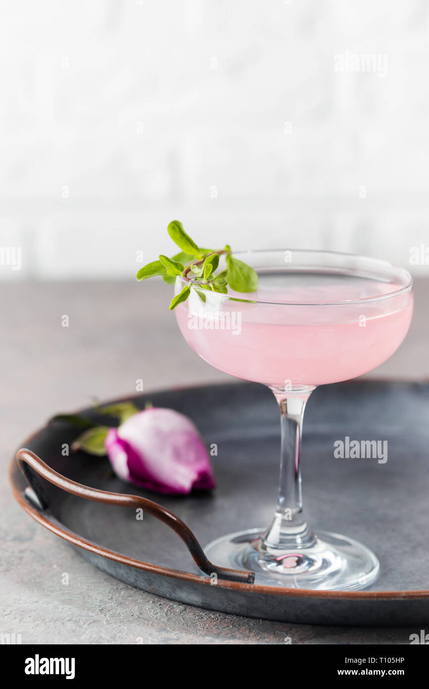 Summer refreshment drinks. Light pink rose cocktail, with rose wine on ...