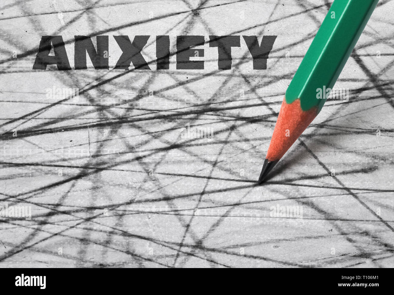 Pencil and word Anxiety written on scribbled paper Stock Photo - Alamy