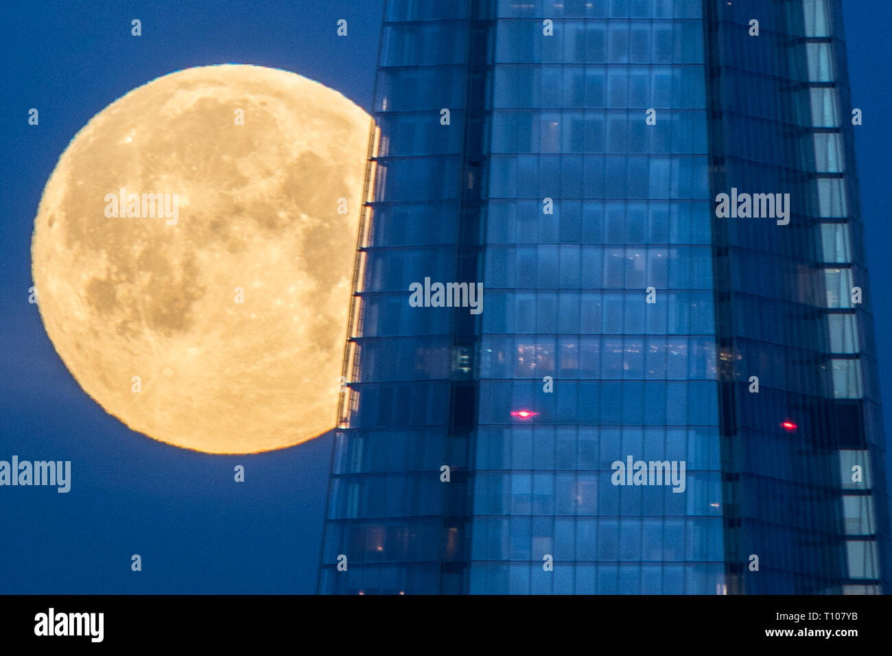 Sequence of images showing the moment the Full moon passes behind ...