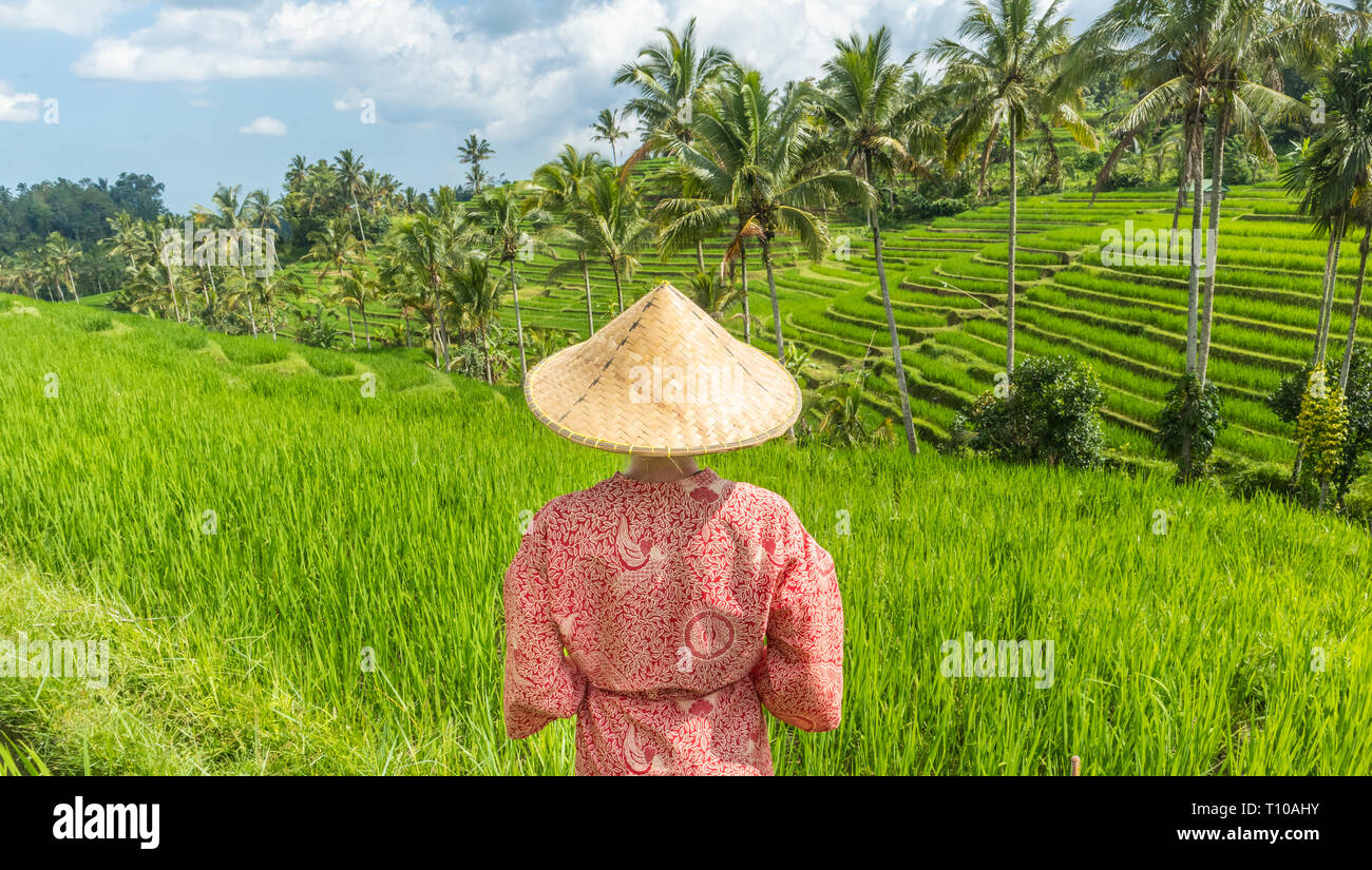 Relaxed fashionable caucasian woman wearing red asian style kimono and ...