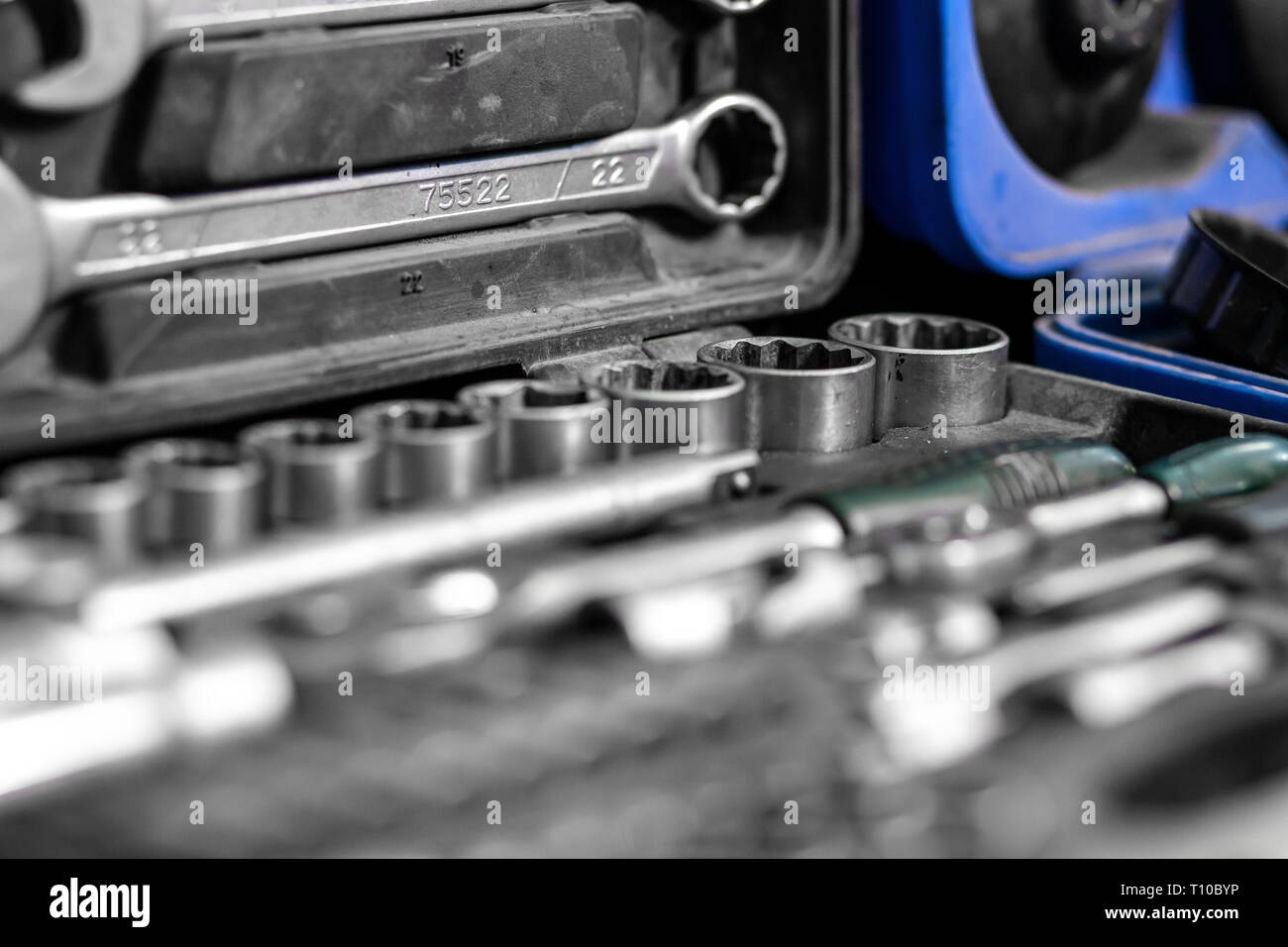 Flat Lay metal tools: wrenches, ratchet, a set of interchangeable heads ...